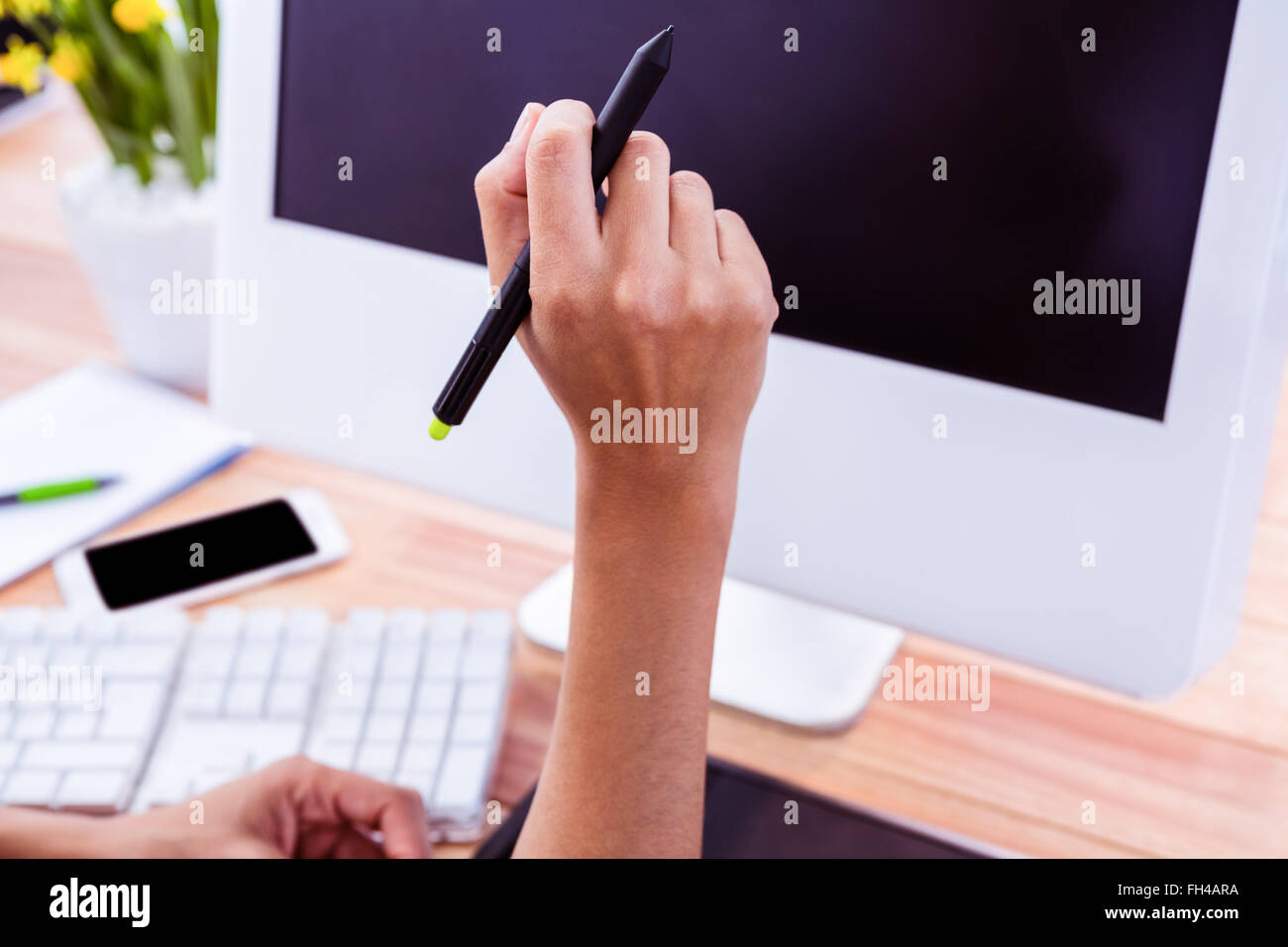 Part of hand holding stylus Stock Photo - Alamy