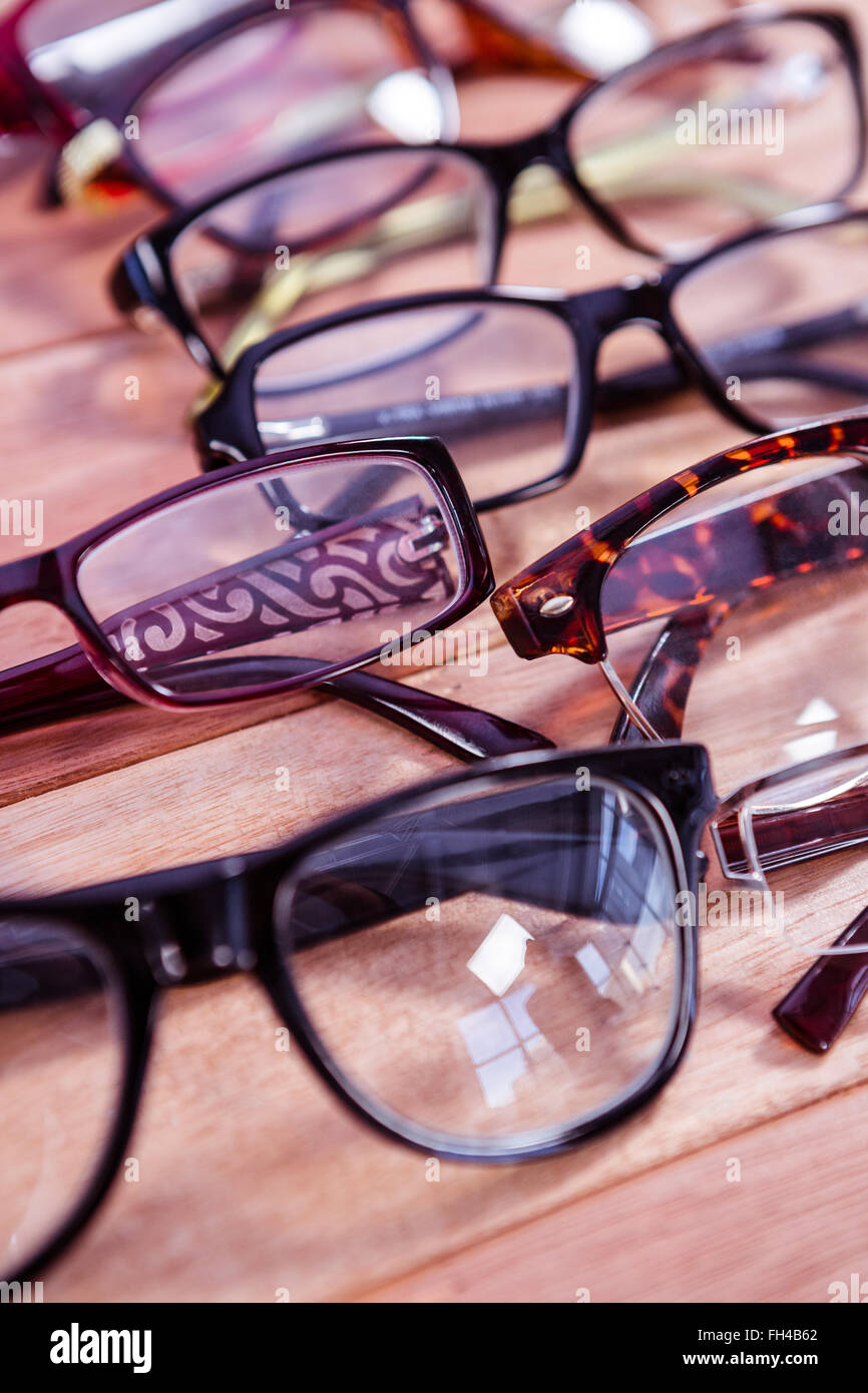 Reading glasses on table Stock Photo - Alamy