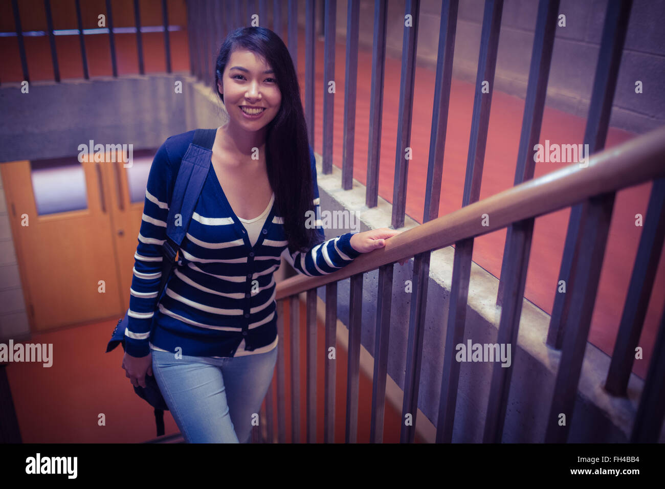 Student walking up steps hi-res stock photography and images - Alamy