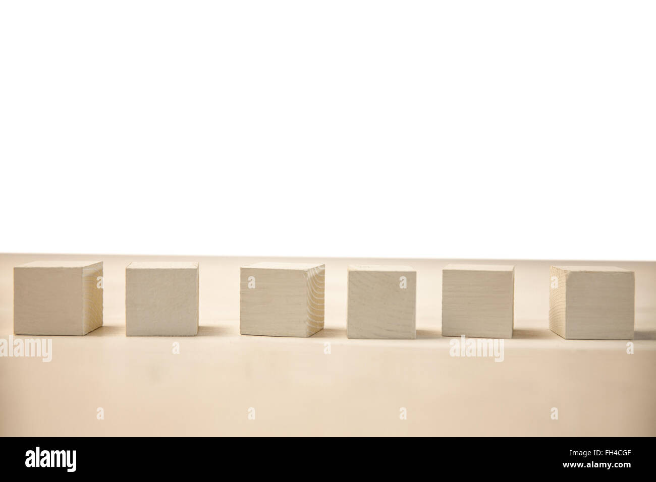 Row of blocks on table Stock Photo - Alamy