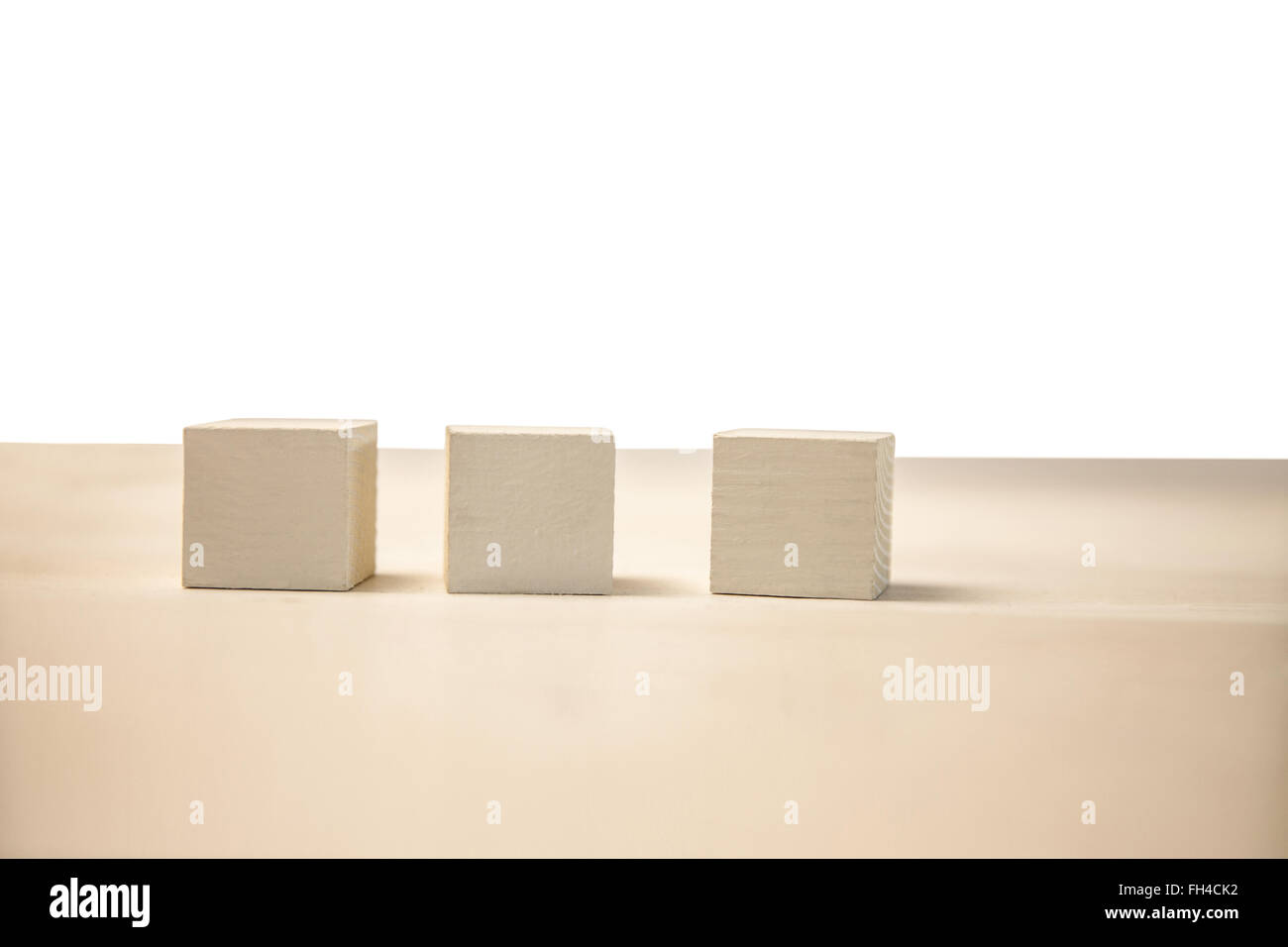 Row of blocks on table Stock Photo - Alamy