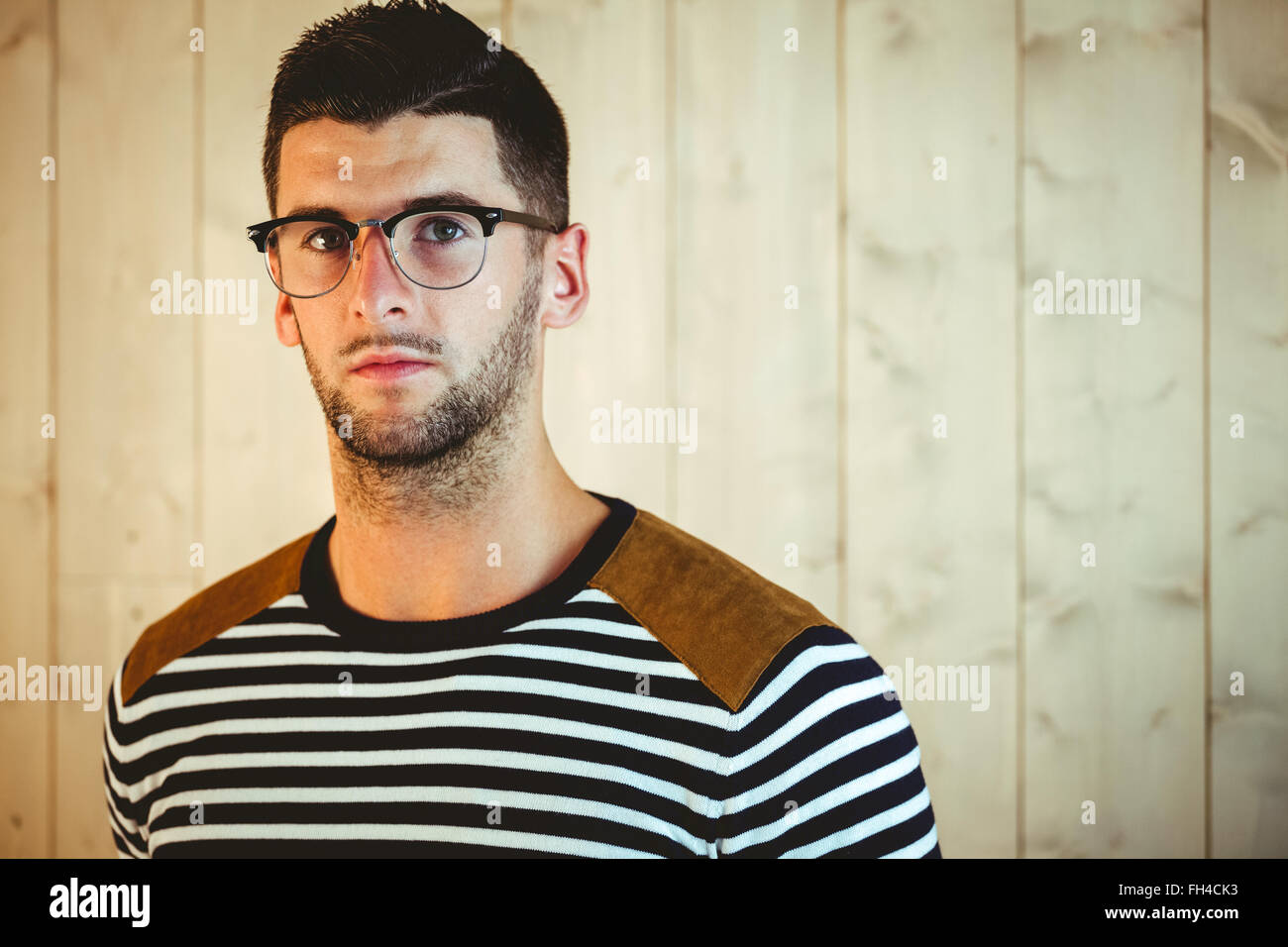 Handsome hipster posing for camera Stock Photo - Alamy
