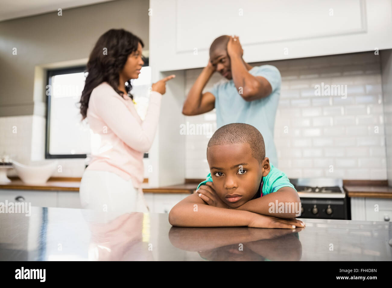Parents arguing in front of son Stock Photo - Alamy