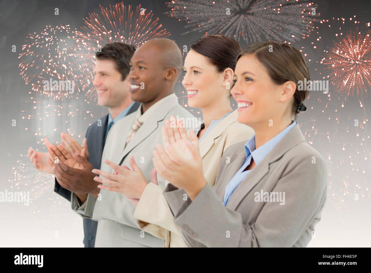 Standing looking away smiling clapping hands hi-res stock photography ...