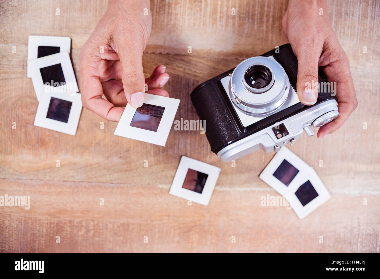 View of hands using retro camera Stock Photo - Alamy