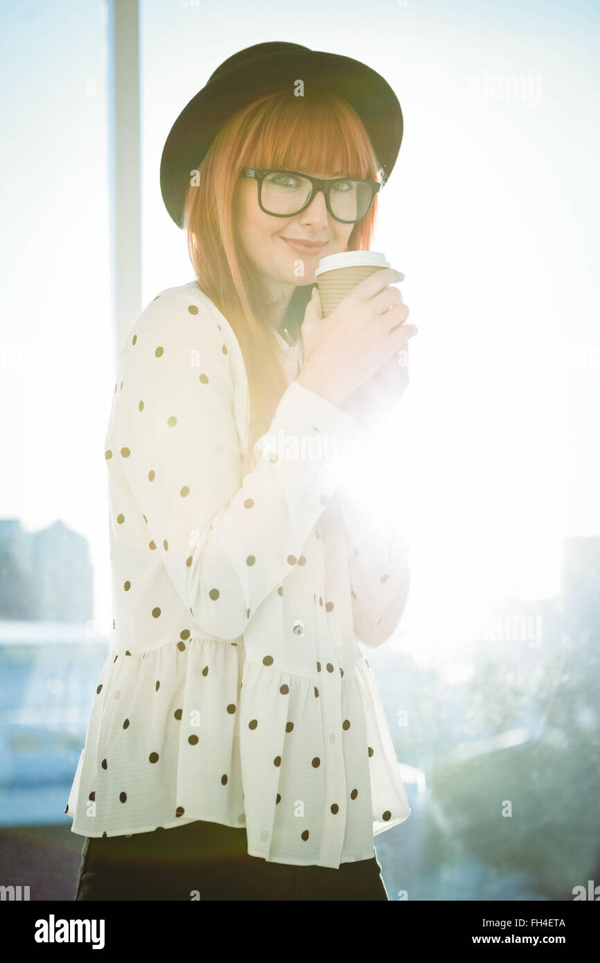 Smiling hipster woman drinking coffee Stock Photo - Alamy