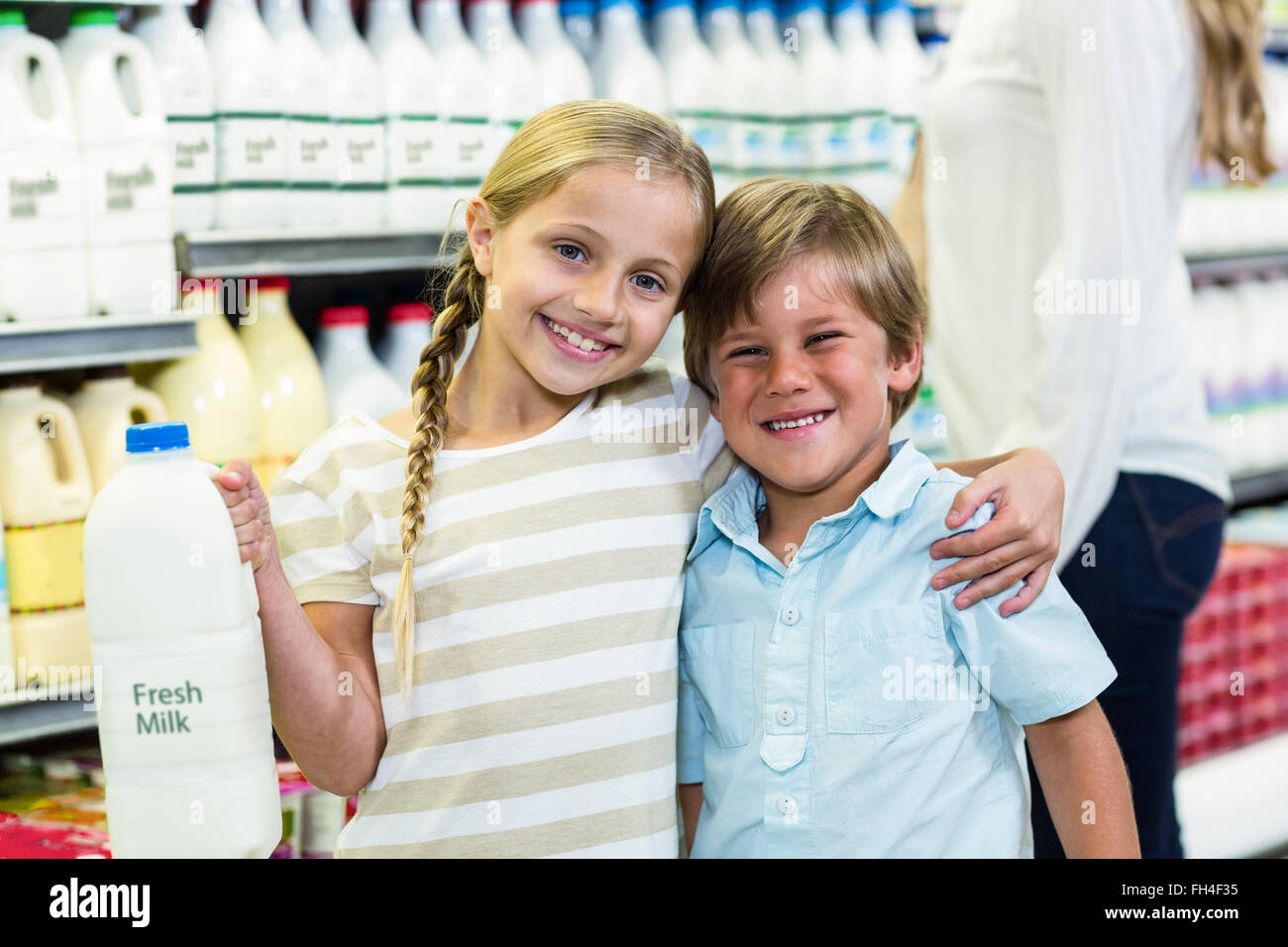 Smiling children holding milk Stock Photo - Alamy