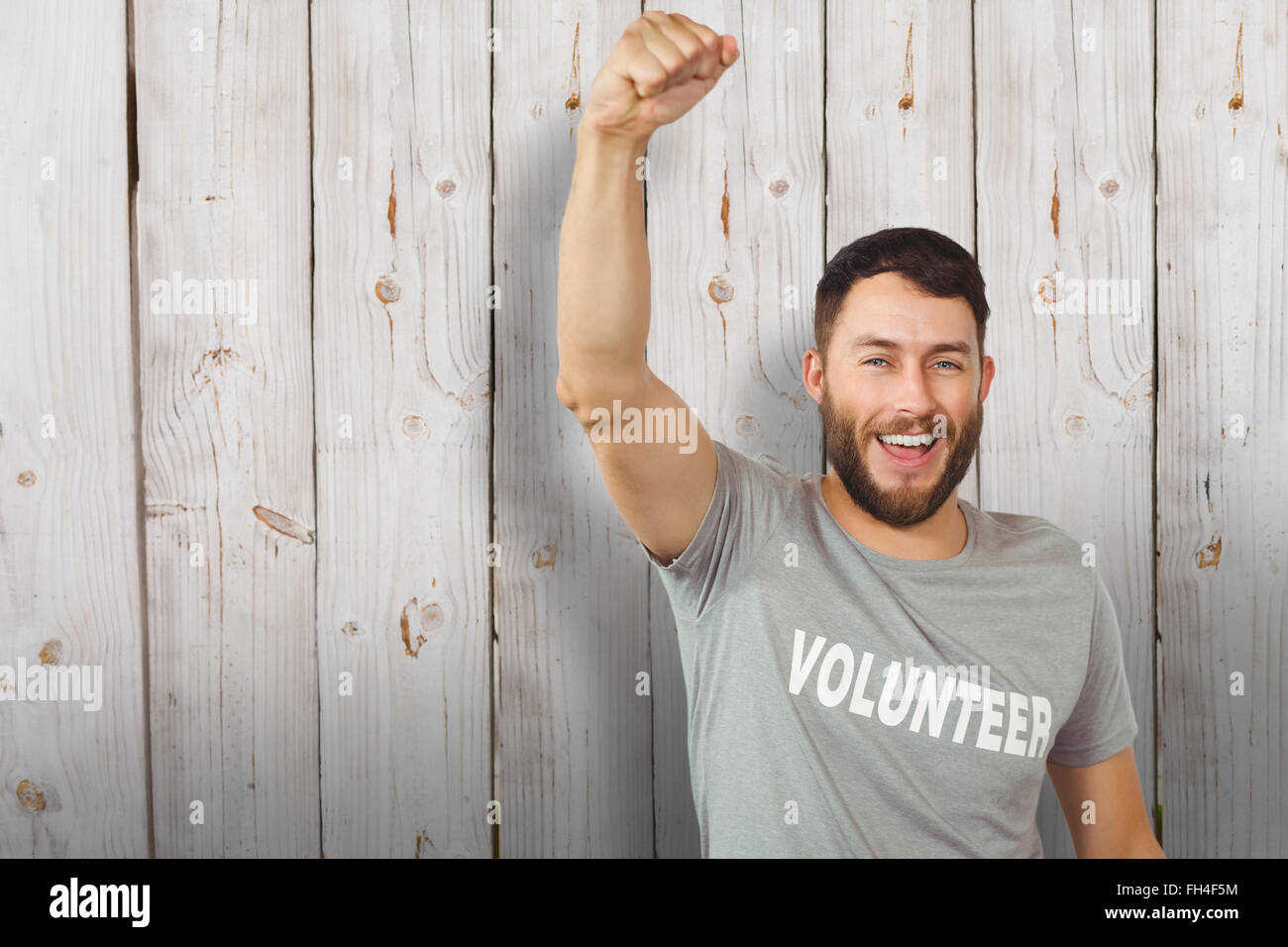 Composite image of portrait of cheerful volunteer Stock Photo - Alamy
