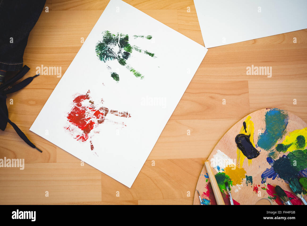 Sheet of paper with hand prints on it Stock Photo - Alamy