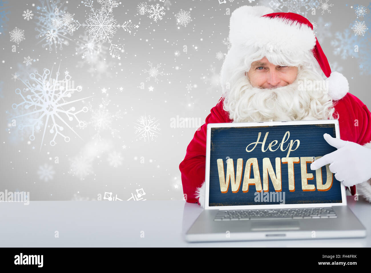 Composite image of santa using laptop Stock Photo - Alamy