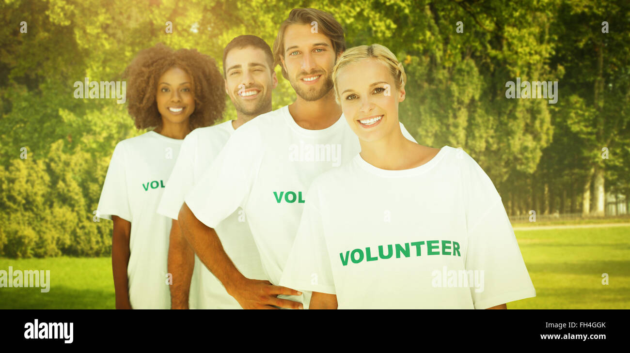 Composite image of smiling volunteer group Stock Photo - Alamy