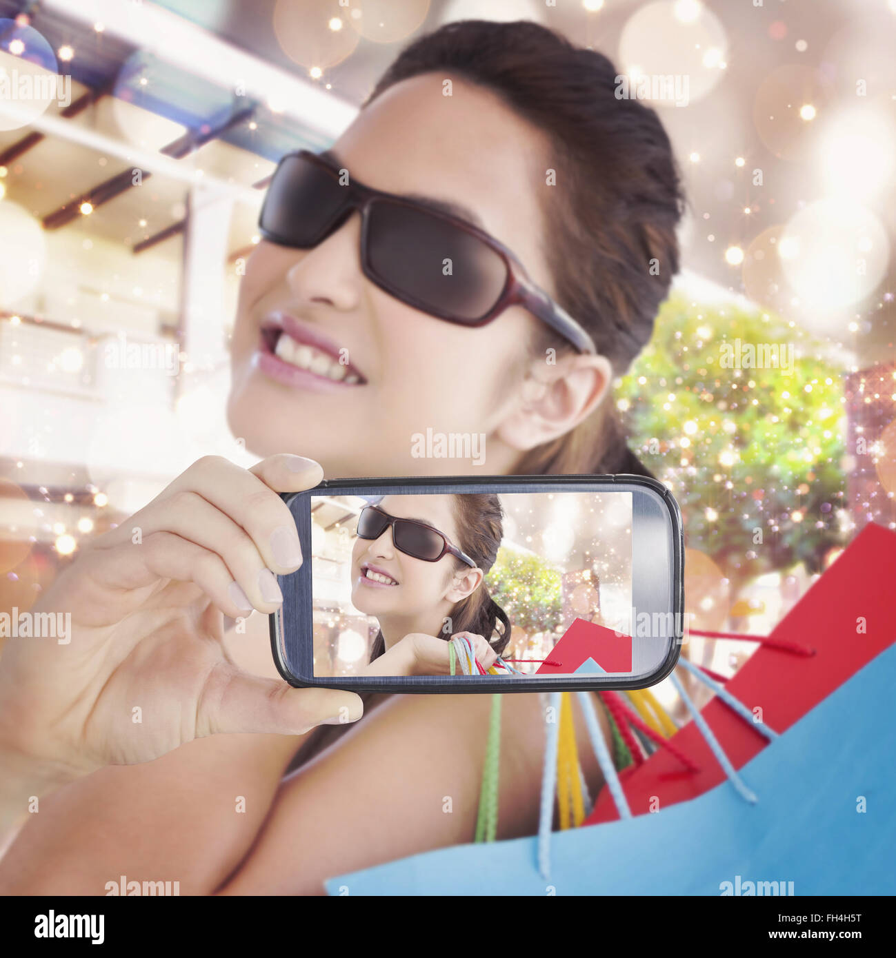Composite image of hand holding smartphone showing Stock Photo - Alamy