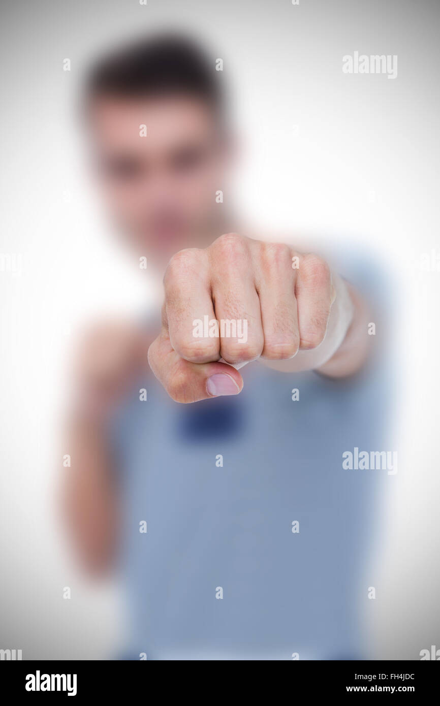 Composite image of portrait of handsome man punching in the air Stock ...