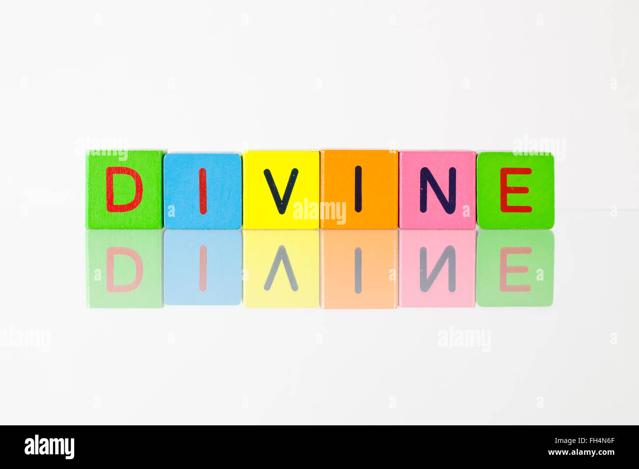 Divine - an inscription from children's wooden blocks Stock Photo - Alamy