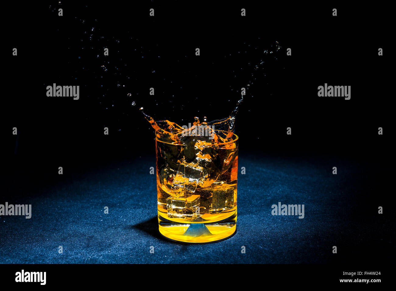 ice with liquid splashing Stock Photo - Alamy