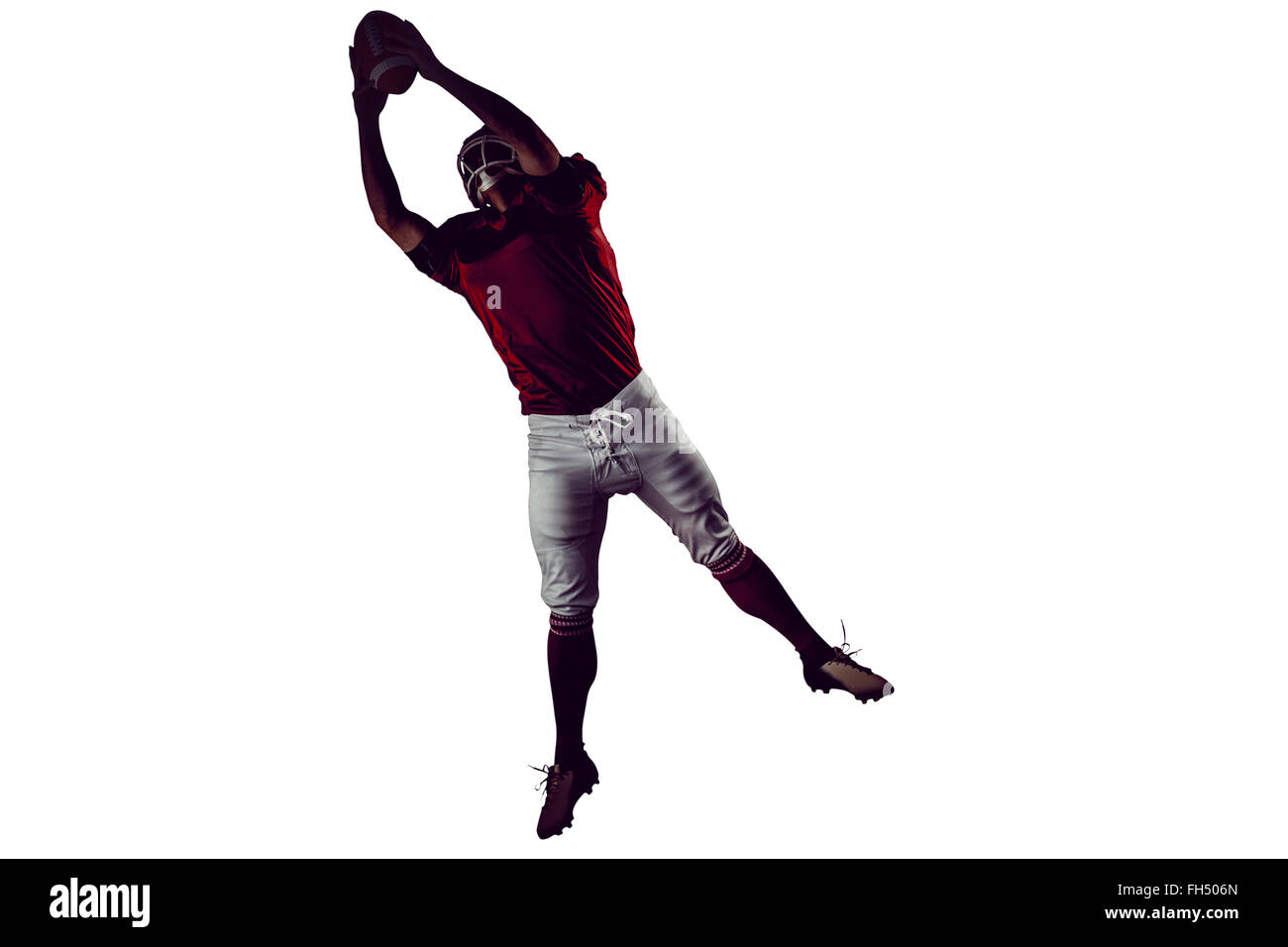 American football player catching football Stock Photo - Alamy