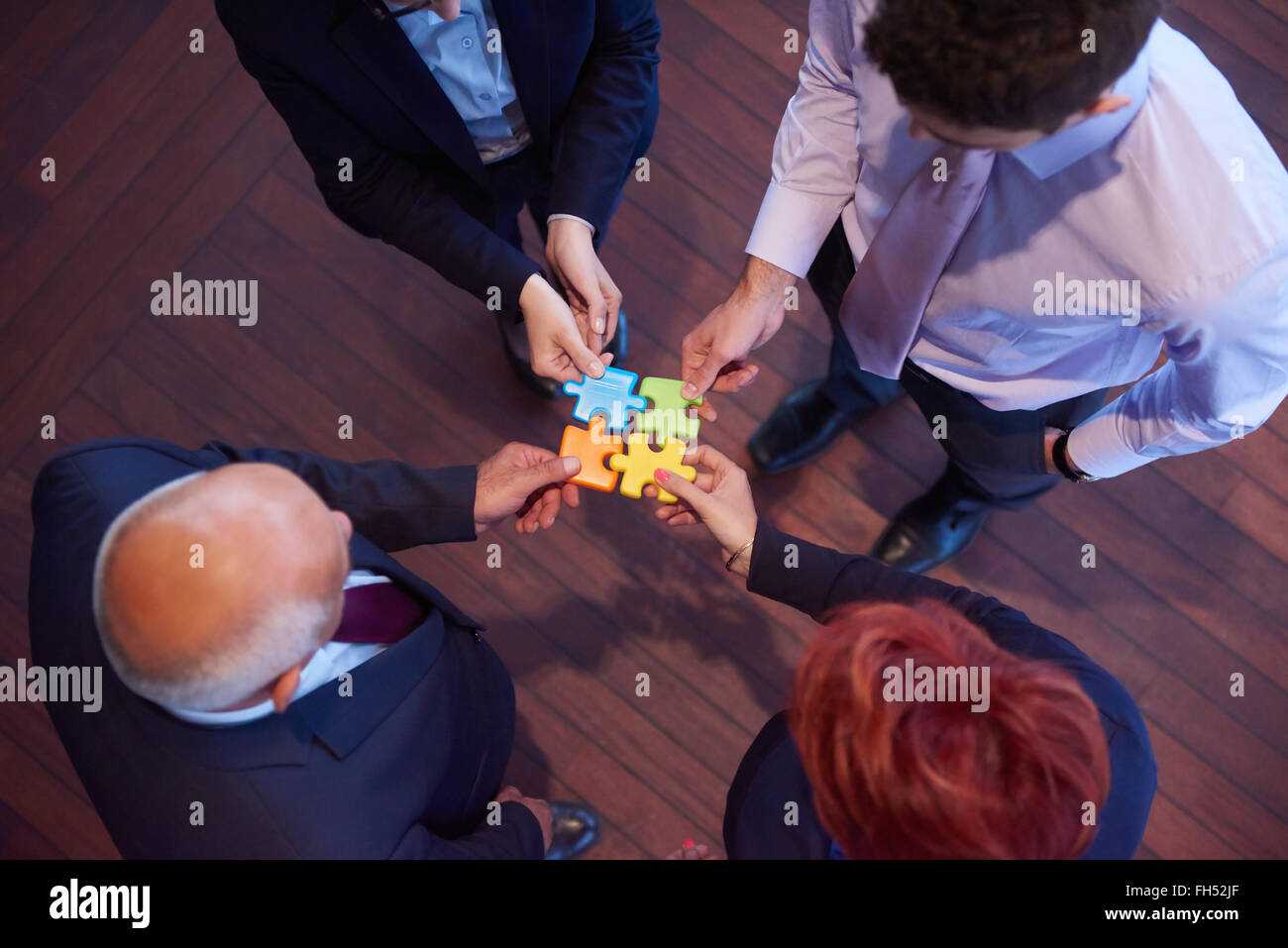 assembling jigsaw puzzle Stock Photo - Alamy