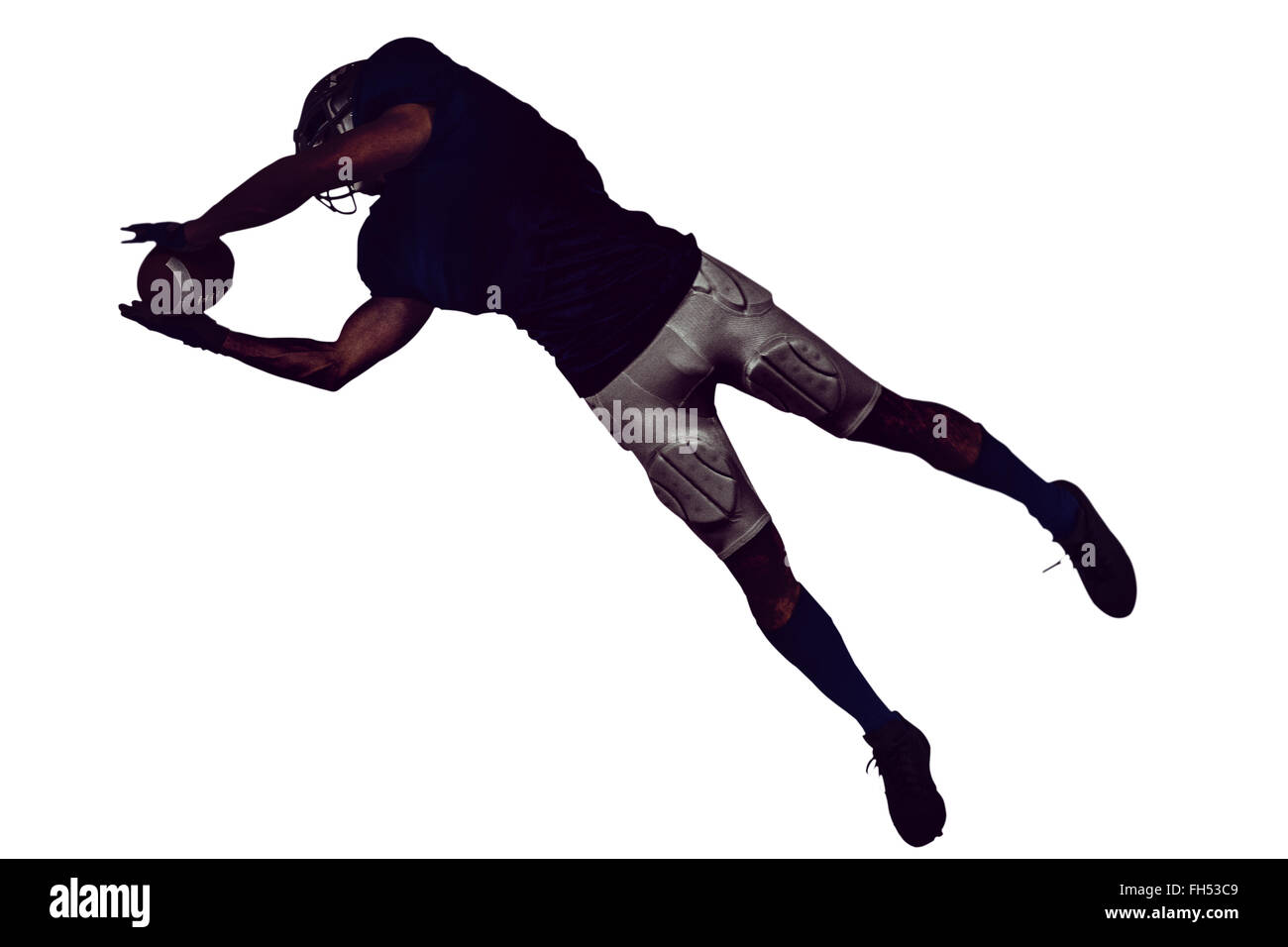 American football player catching ball in mid-air Stock Photo - Alamy