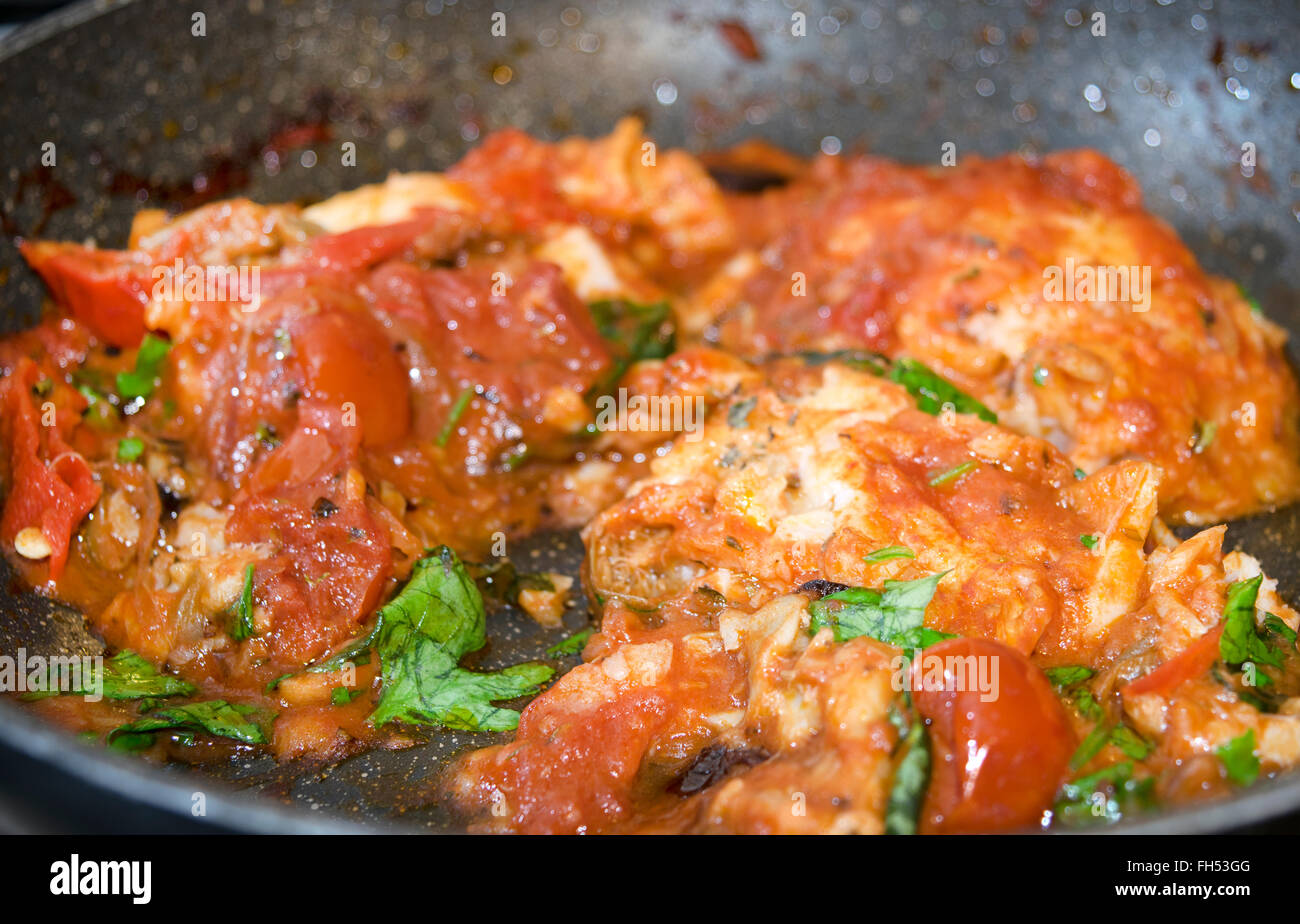 sicilian style cod fillet with cherry tomatoes and olives Stock Photo ...