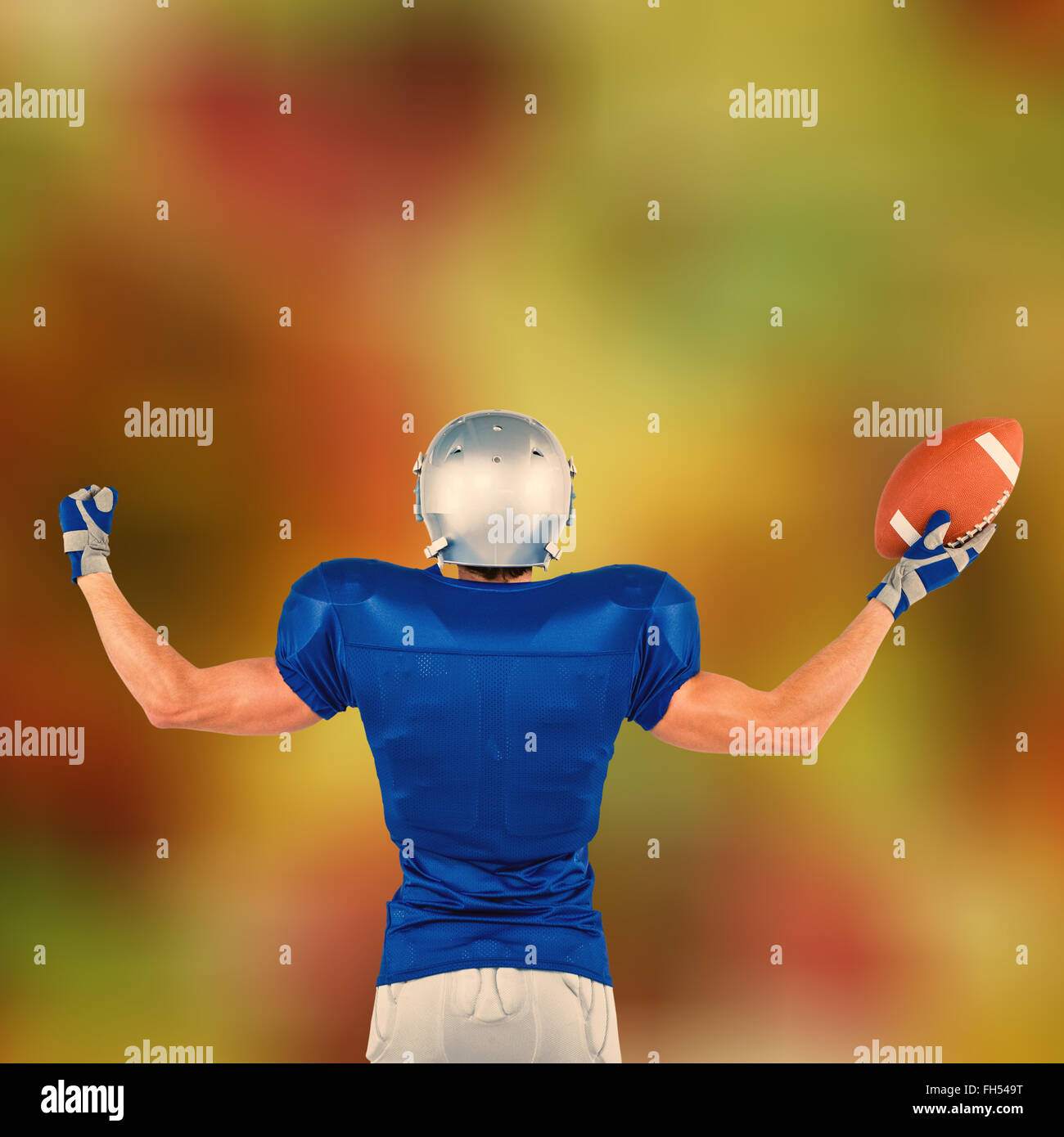 Composite image of rear view of american football player holding ball ...