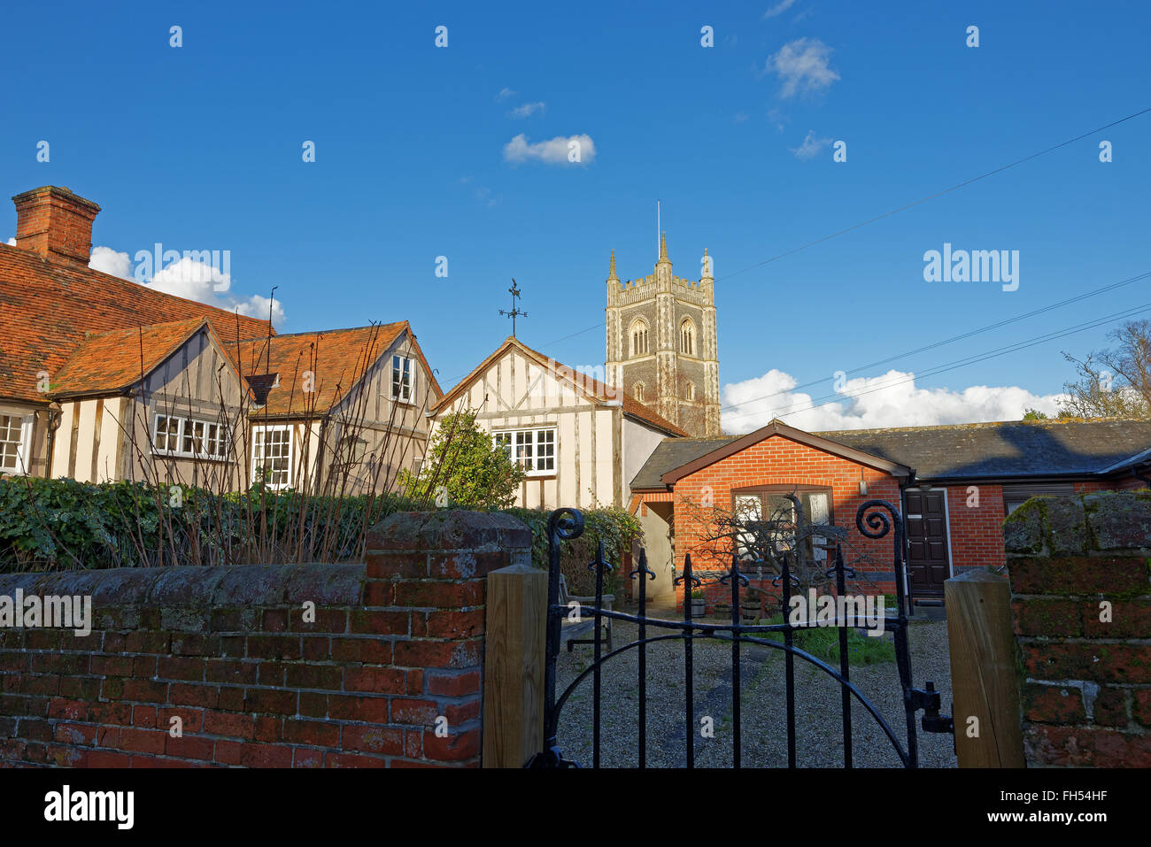 View over rooftops towards the church in the picturesque village of ...
