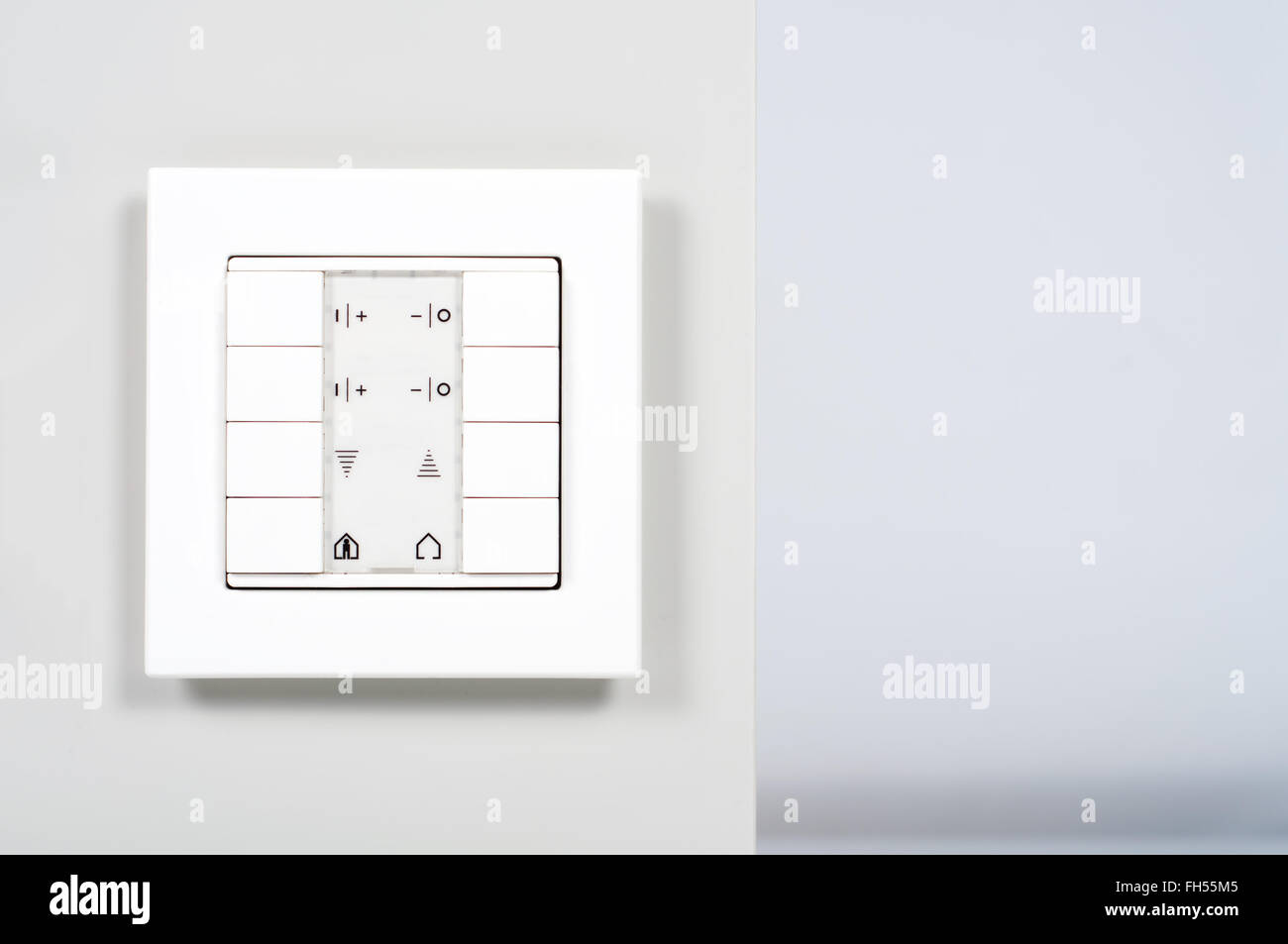 white modern electronic switch on the wall Stock Photo - Alamy