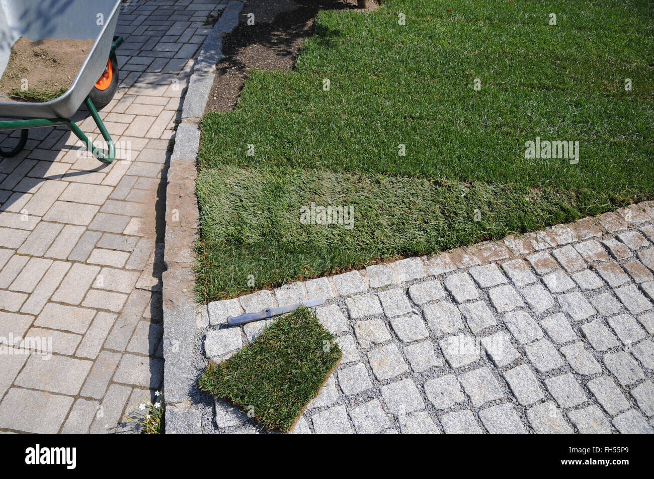 Laying sod, cutting sod-pieces Stock Photo - Alamy