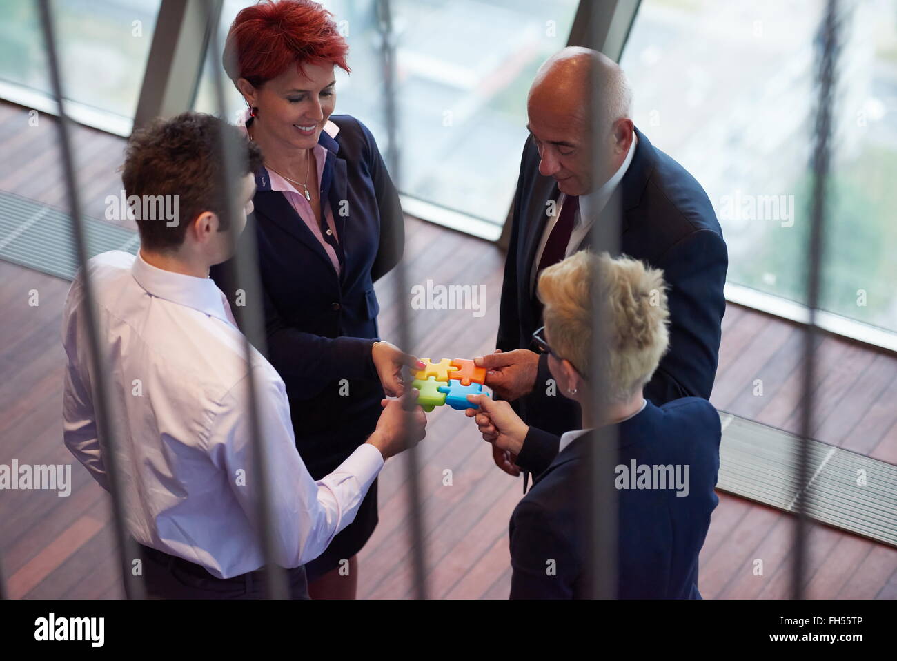 assembling jigsaw puzzle Stock Photo - Alamy