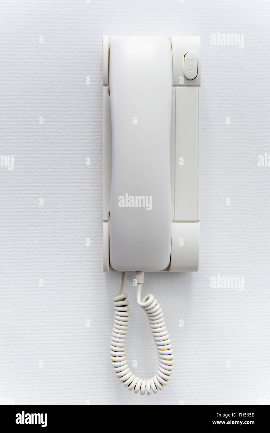 white plastic house intercom on the wall Stock Photo - Alamy