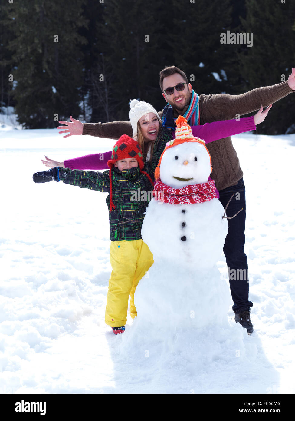 happy family making snowman Stock Photo - Alamy
