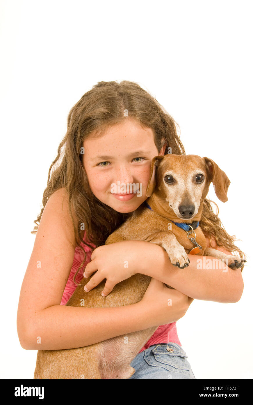 Little Girl Holding a Dog Stock Photo - Alamy