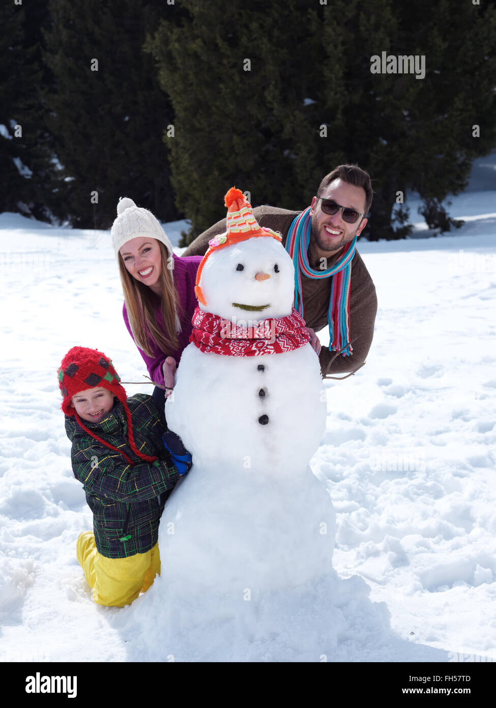 happy family making snowman Stock Photo - Alamy