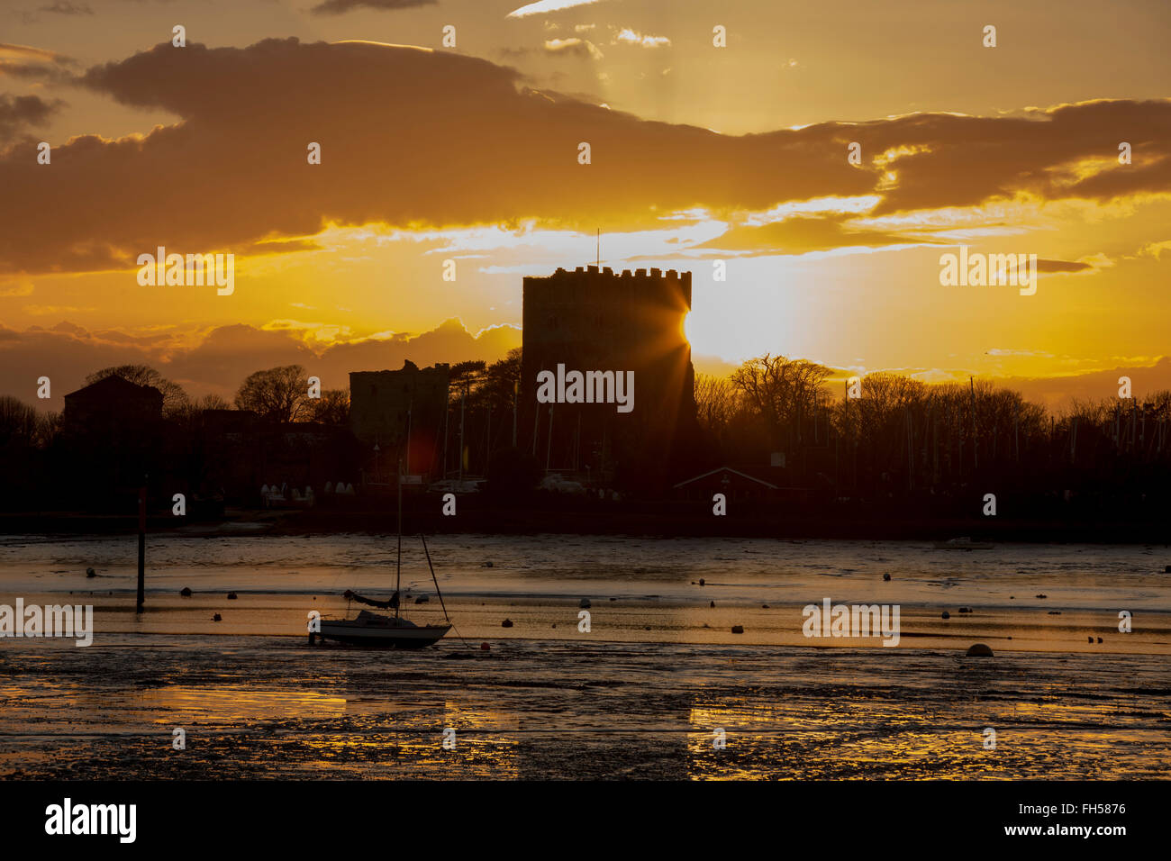 Sunset behind the keep of Portchester Castle. A medieval structure ...