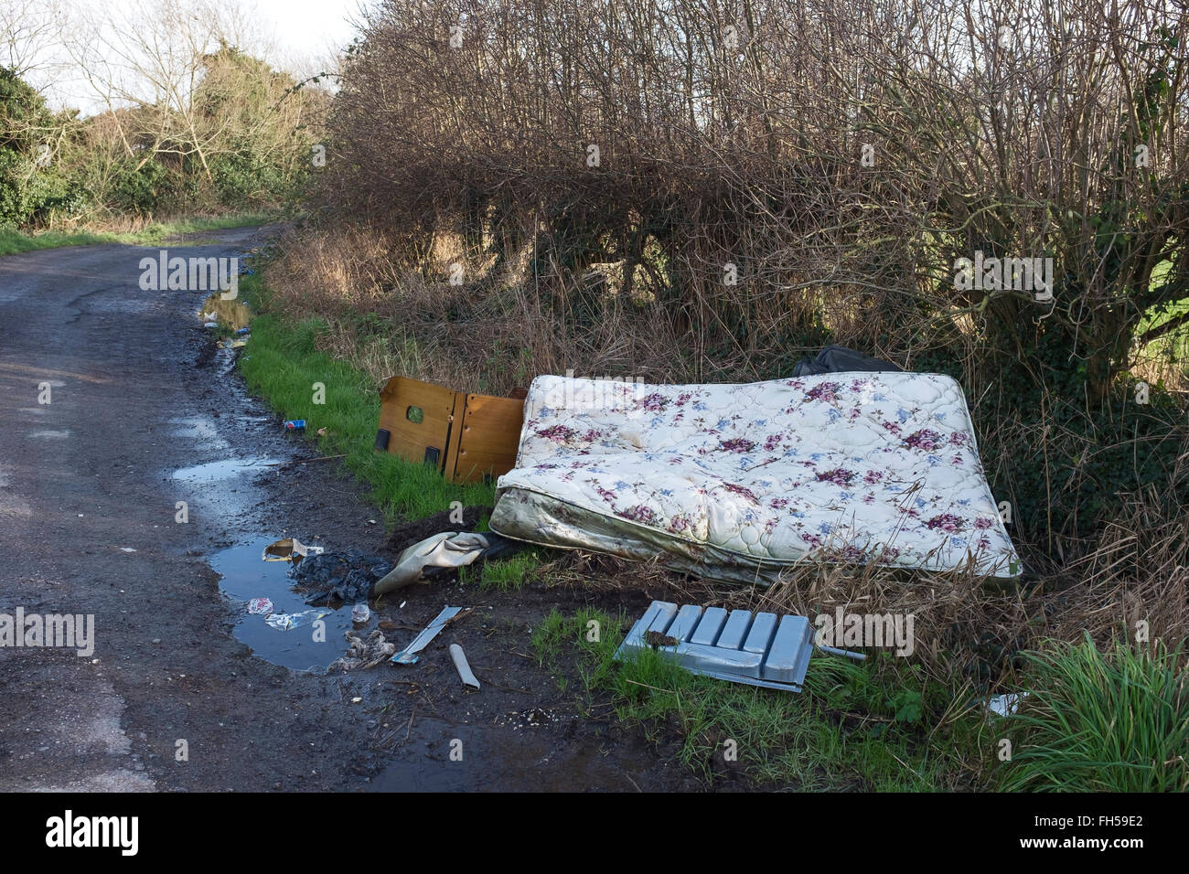 Fly tipping mattress dumped in the countryside Stock Photo - Alamy
