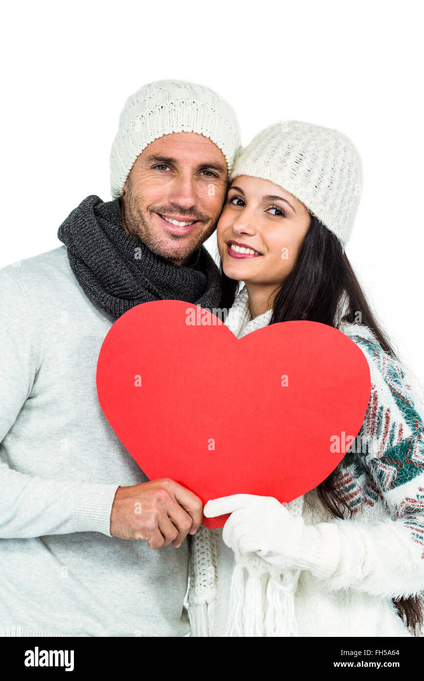 Smiling couple holding paper heart Stock Photo - Alamy