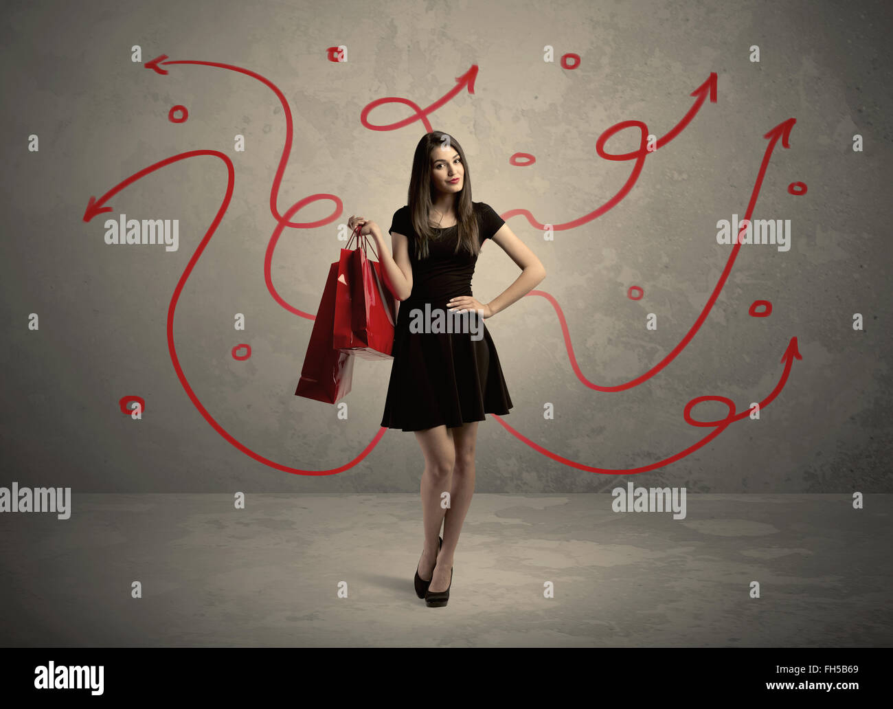 Stylish woman shopping and red arrows Stock Photo - Alamy
