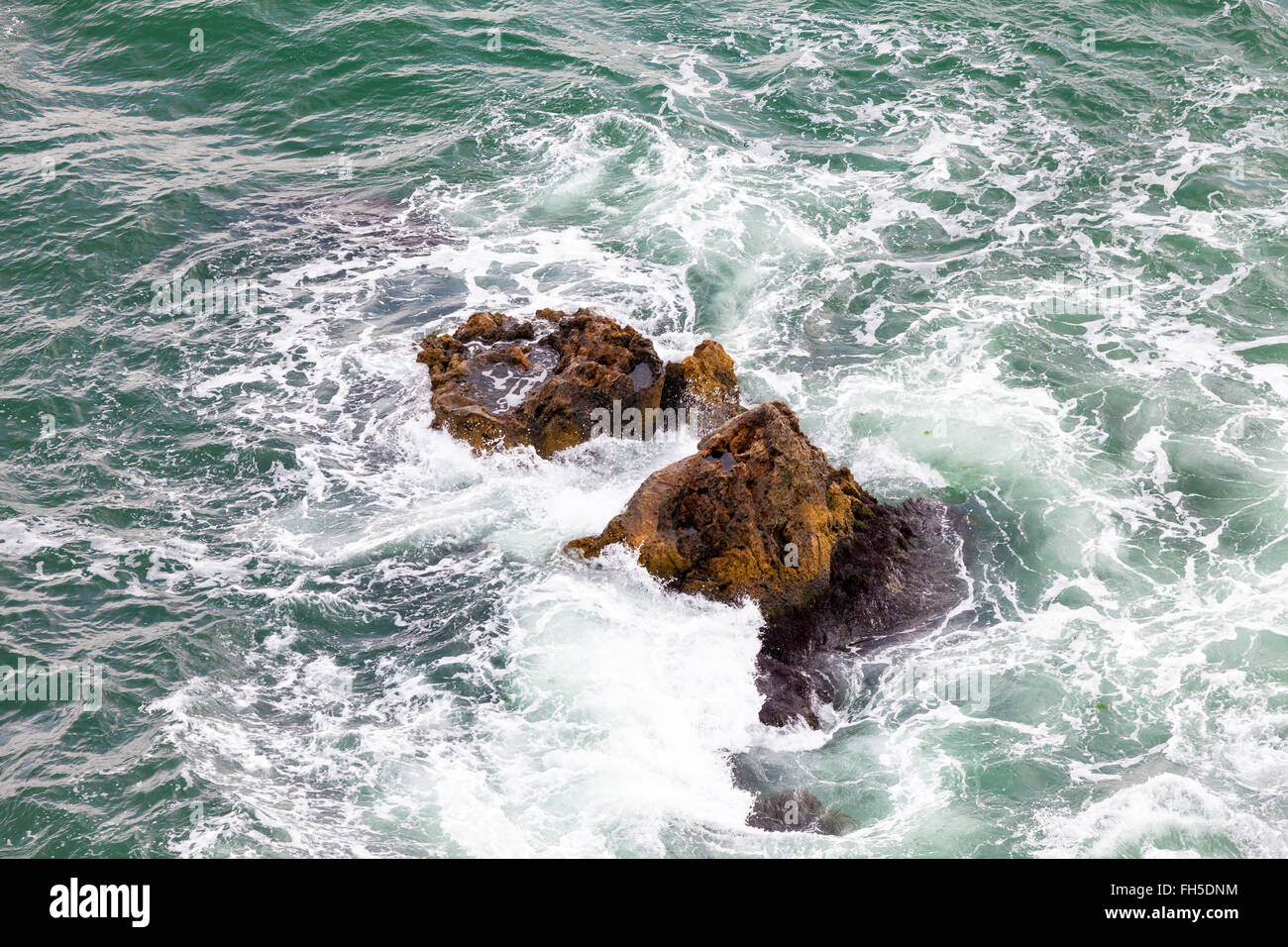Rock and waves Stock Photo - Alamy