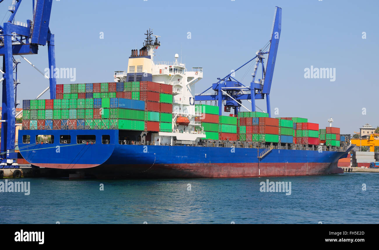 Container Ship is loading in a port Stock Photo - Alamy
