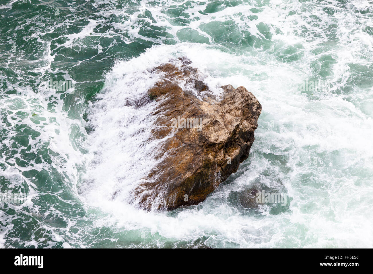 Rock and waves Stock Photo - Alamy