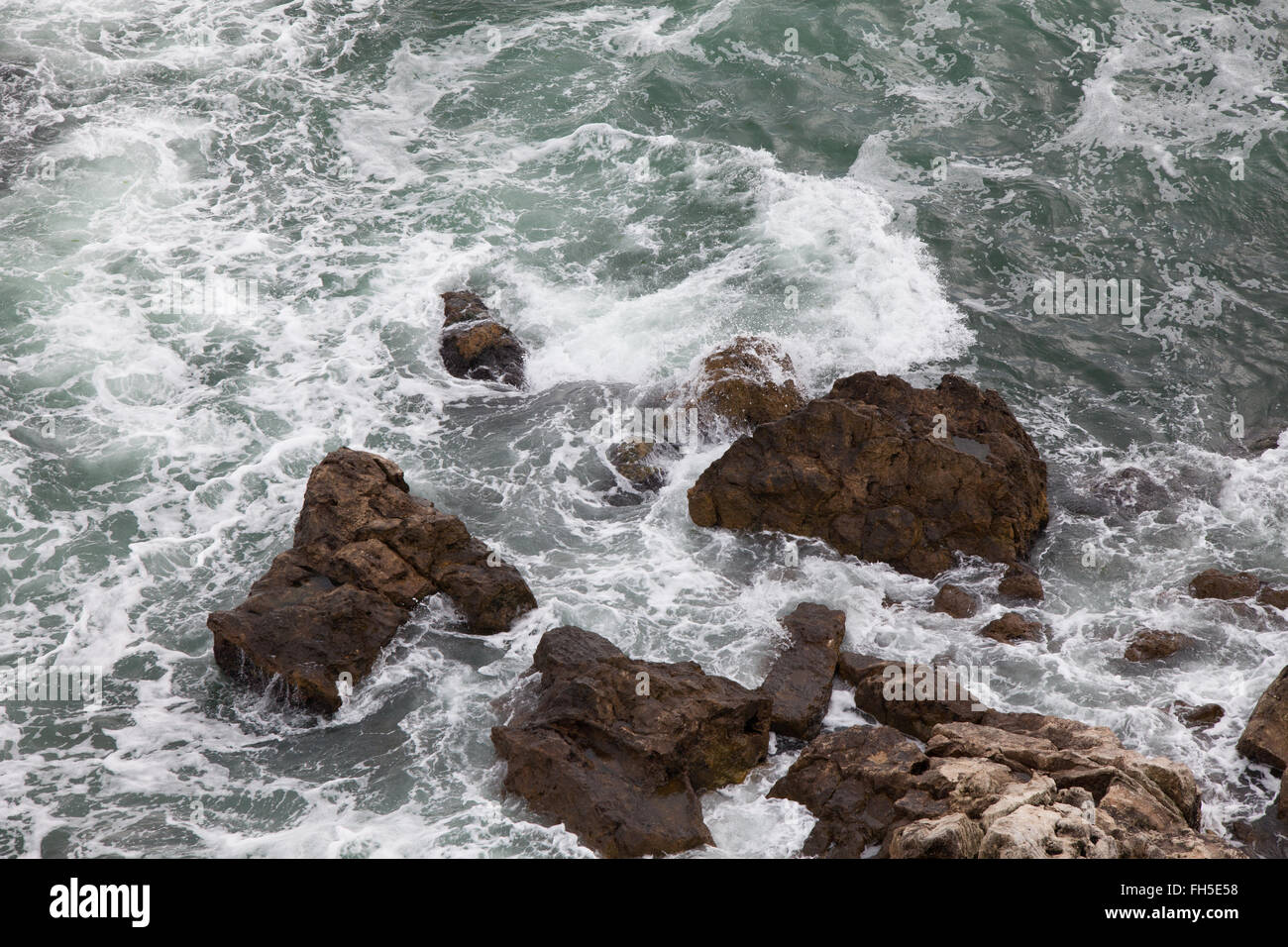 Rock and waves Stock Photo - Alamy