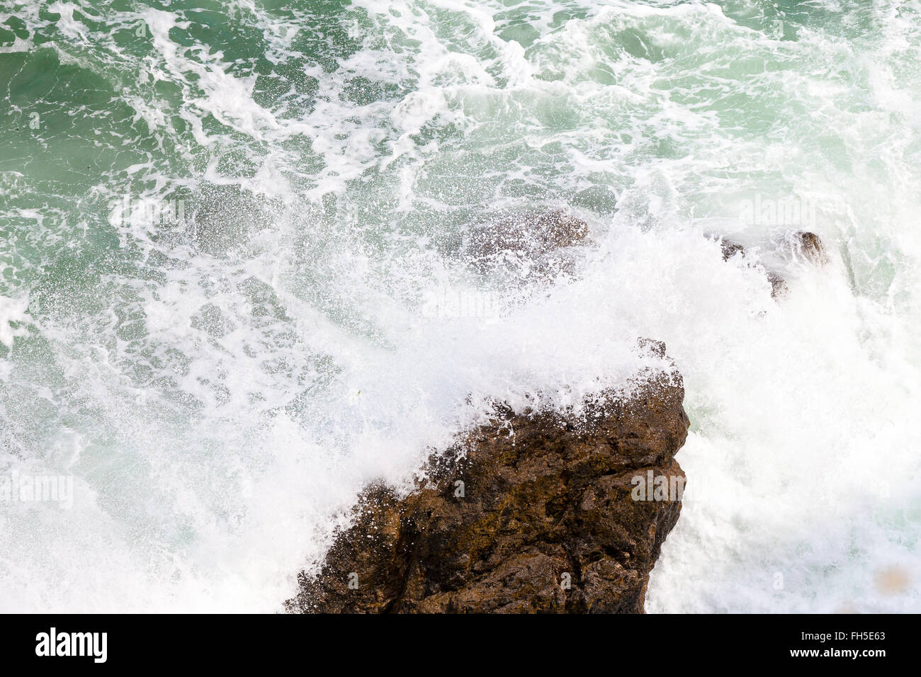 Rock and waves Stock Photo - Alamy