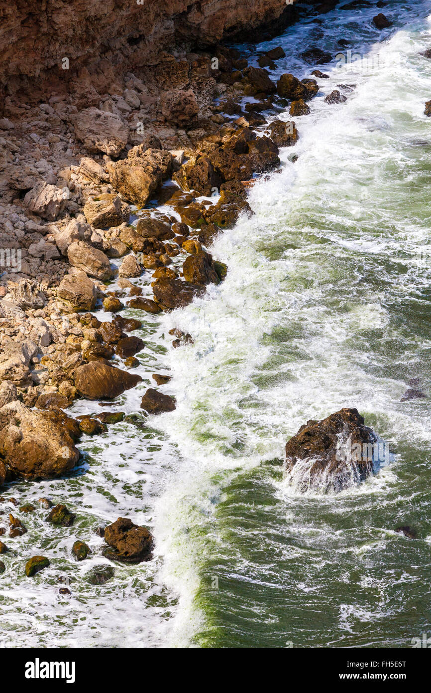 Rock and waves Stock Photo - Alamy