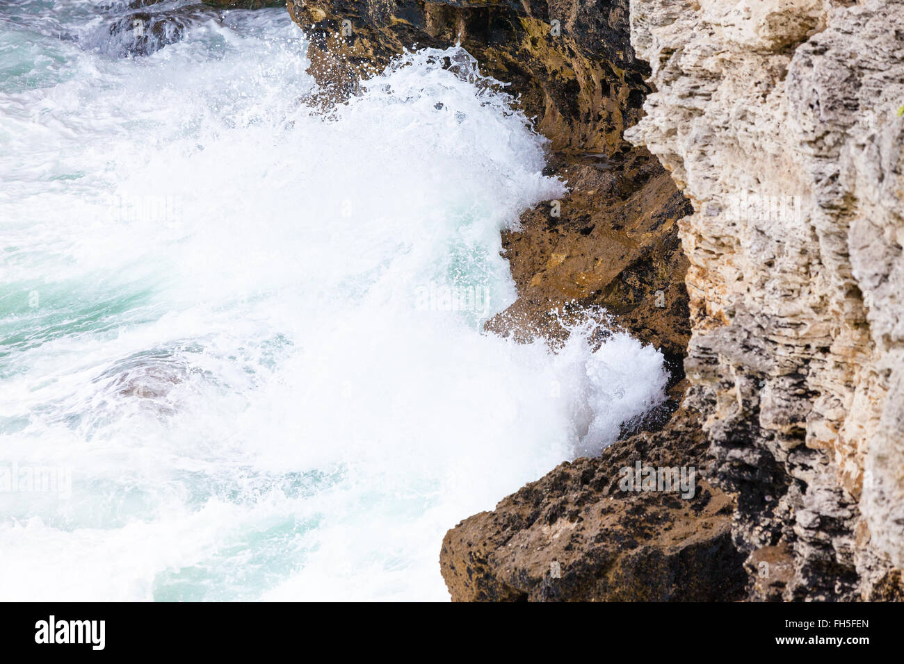 Rock and waves Stock Photo - Alamy