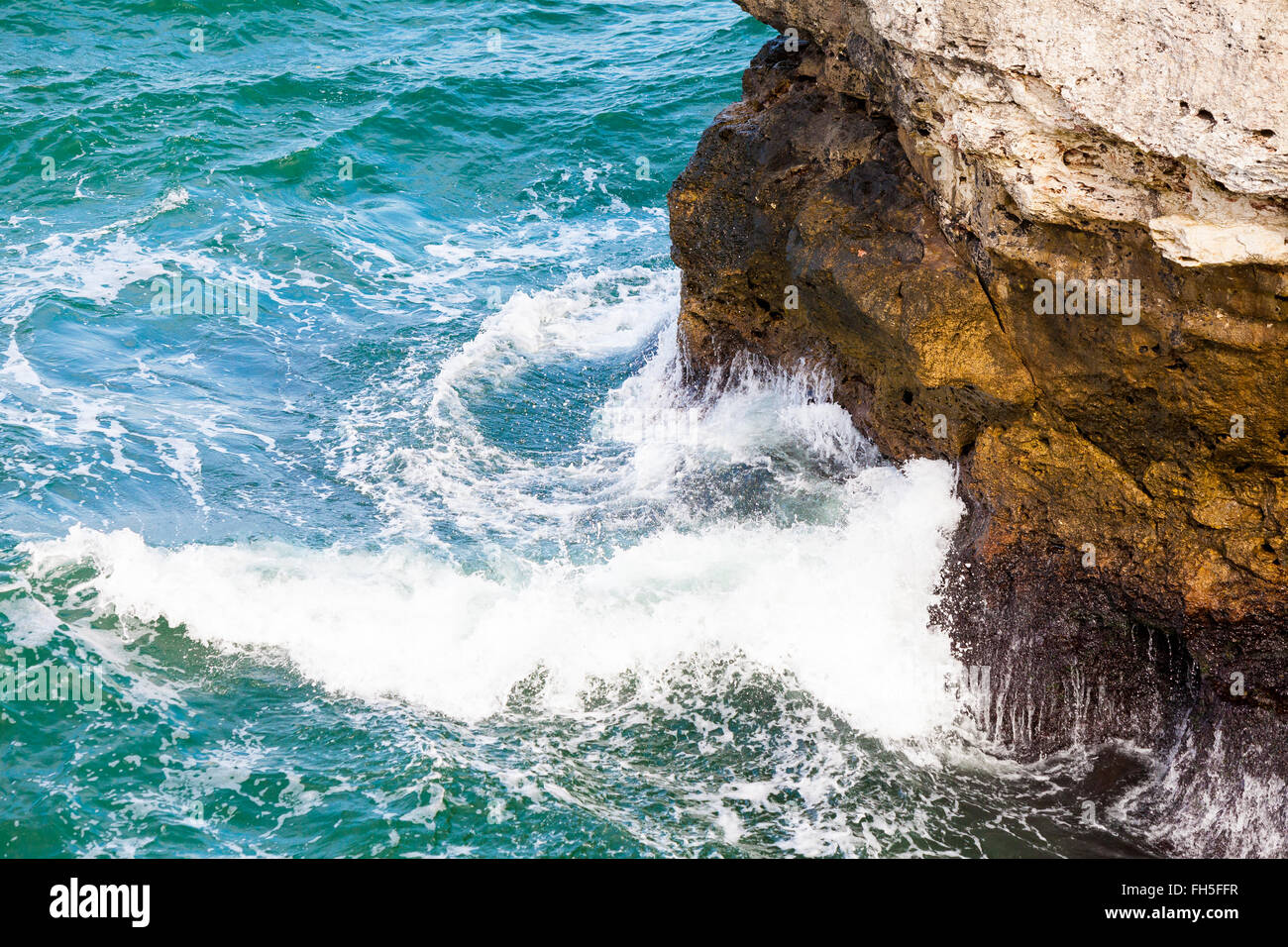 Rock and waves Stock Photo - Alamy