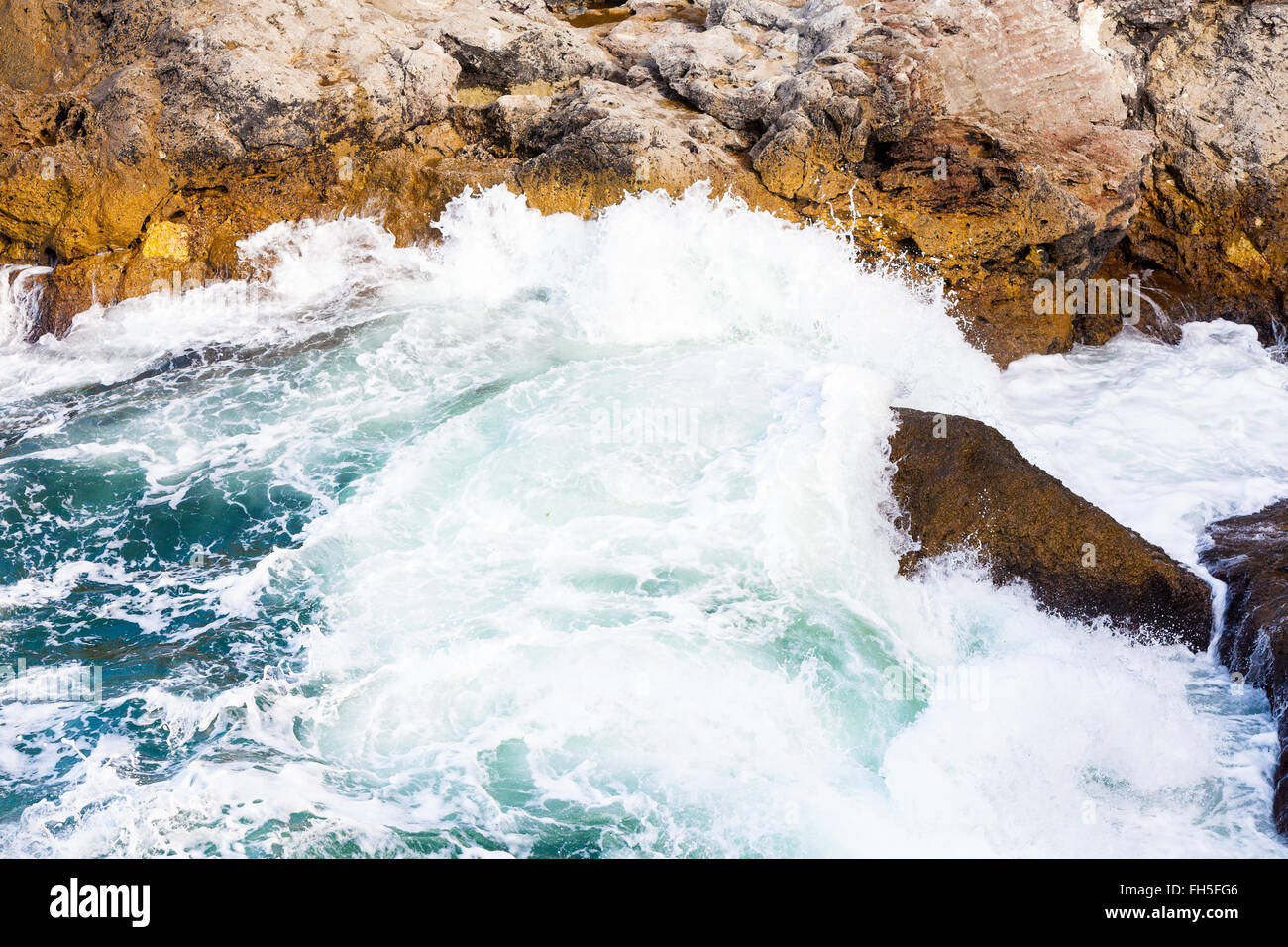 Rock and waves Stock Photo - Alamy