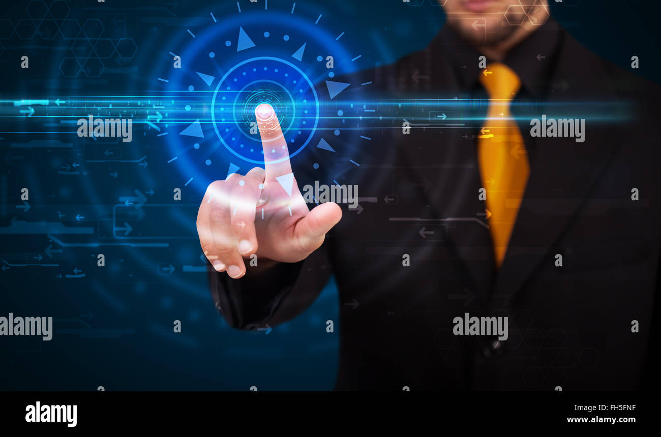 Handsome tech guy pressing high technology control panel screen concept ...