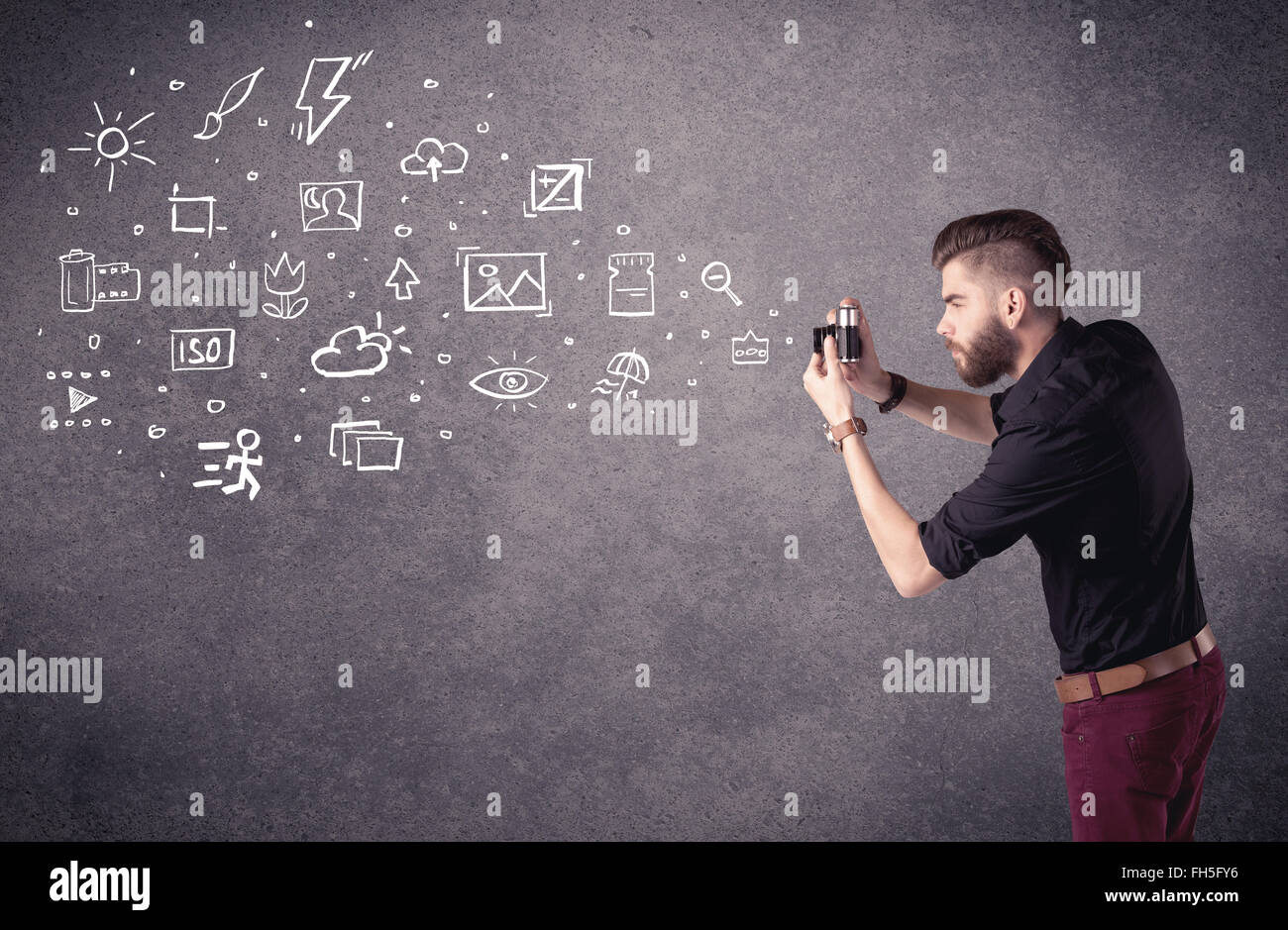 Elegant guy with beard learning photography Stock Photo - Alamy
