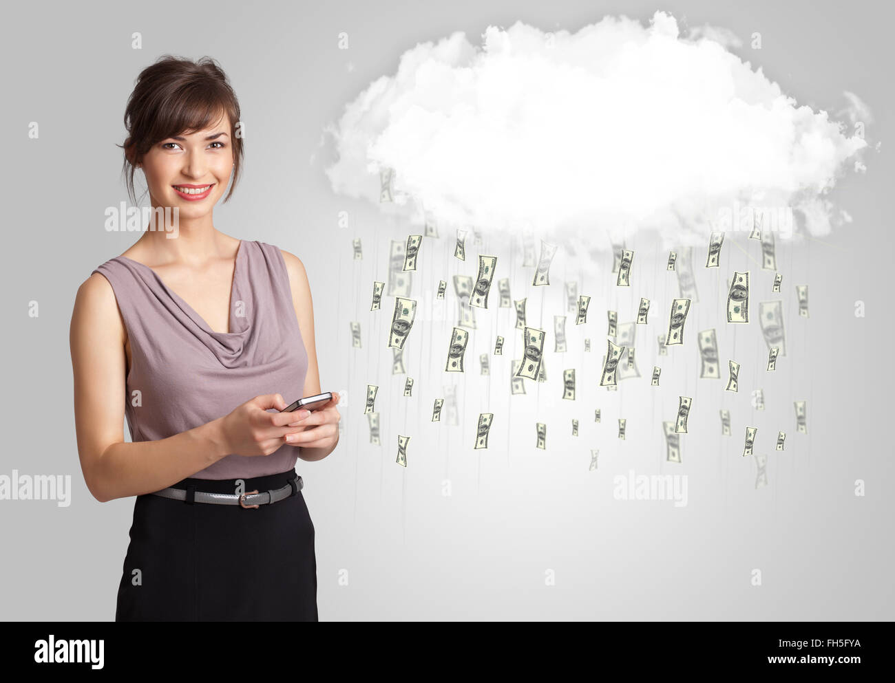 Woman with cloud and money rain concept Stock Photo - Alamy