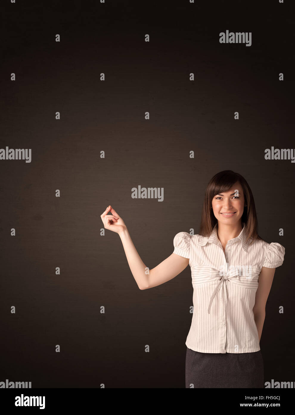 Businesswoman making gestures Stock Photo - Alamy
