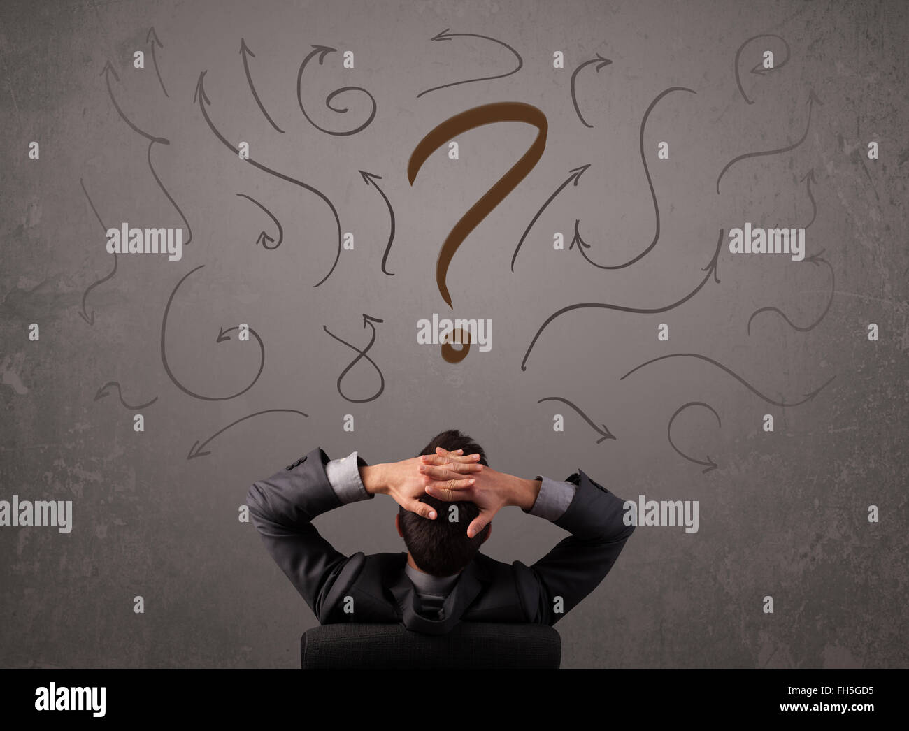 Business man looking at question mark sketch Stock Photo - Alamy